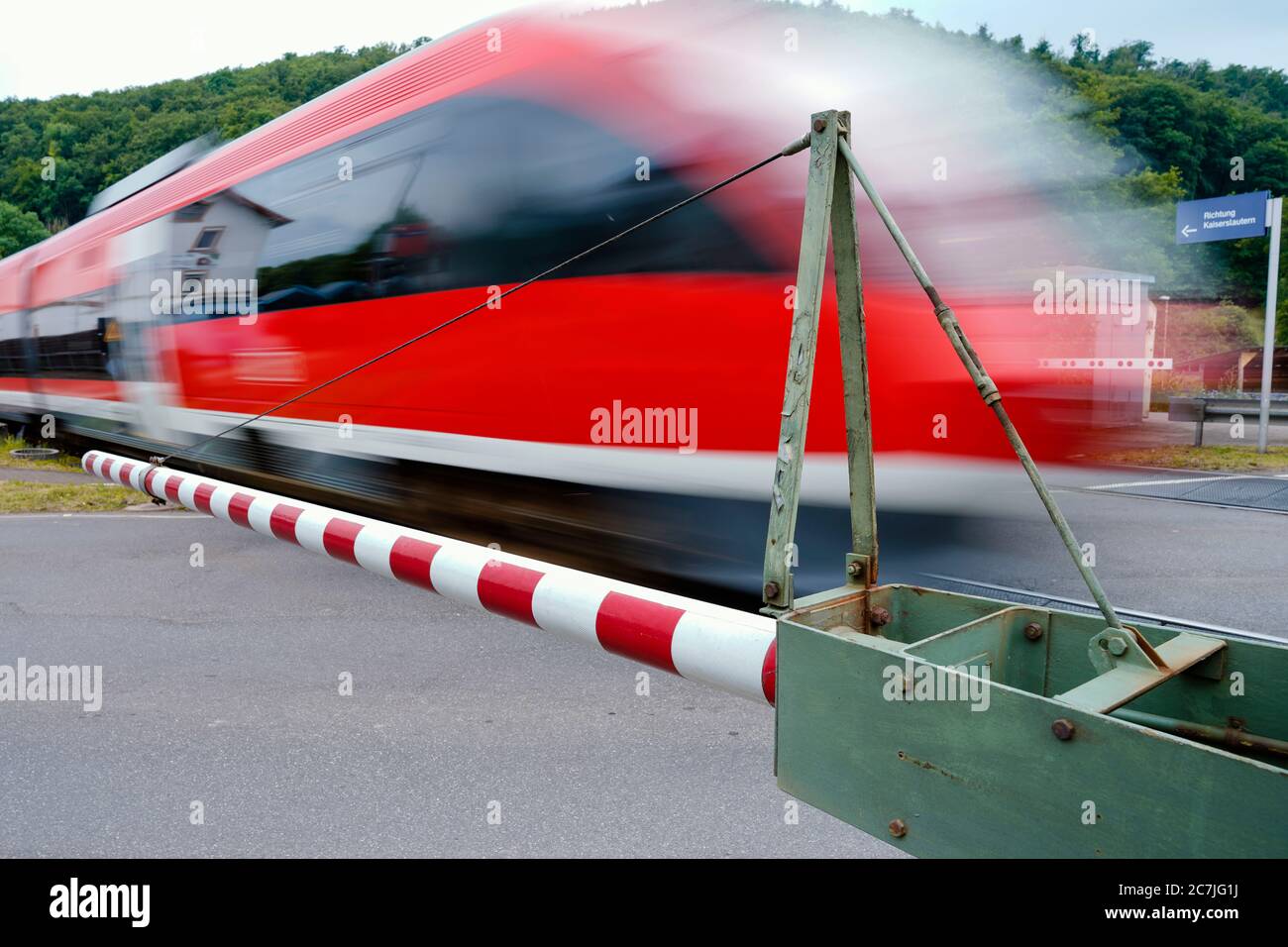 Imsweiler, Germany. 17th June, 2020. A train crosses the Bundesstraße ...