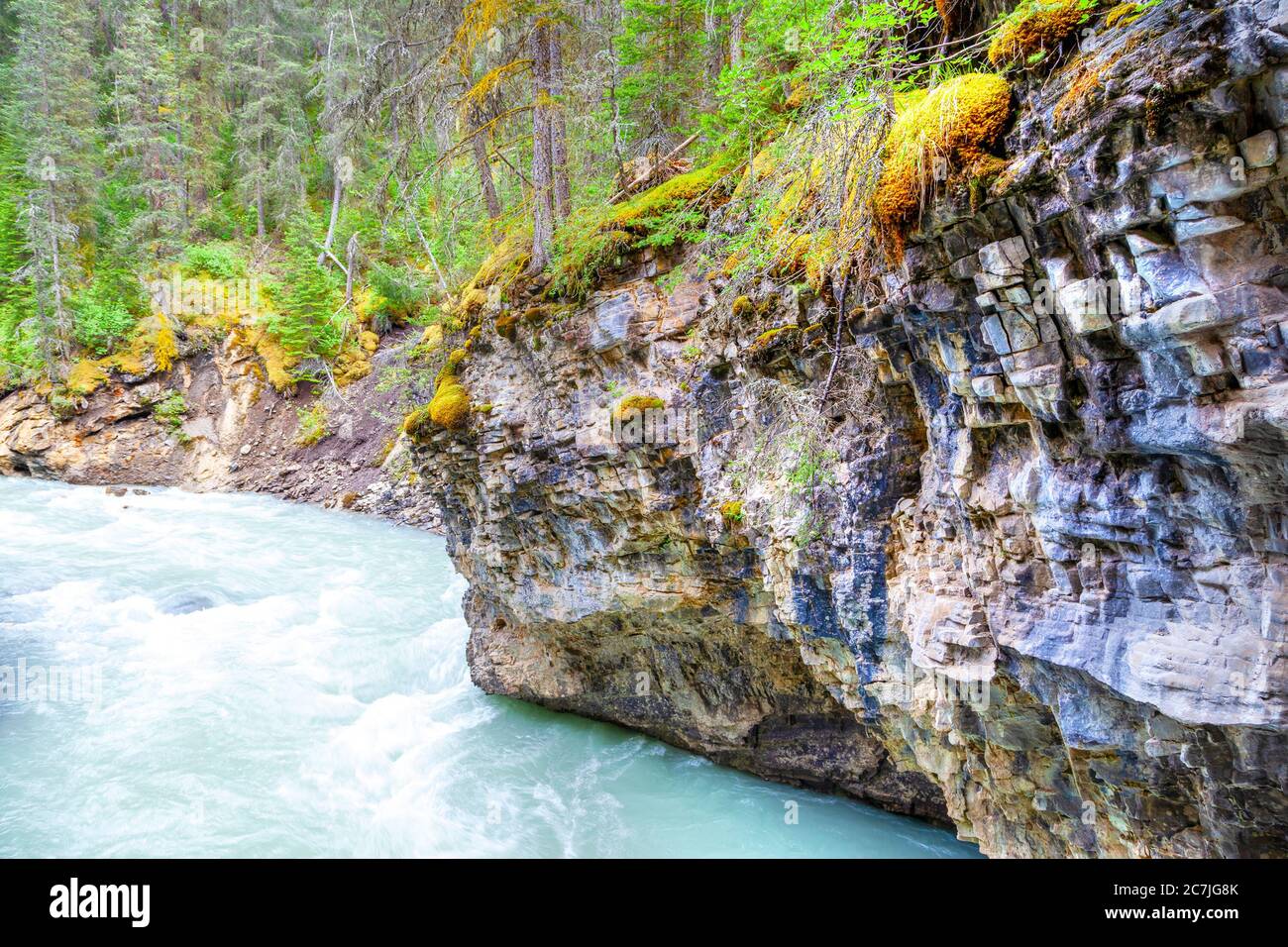 Johnston Canyon in Banff National Park where the canyon walls are ...