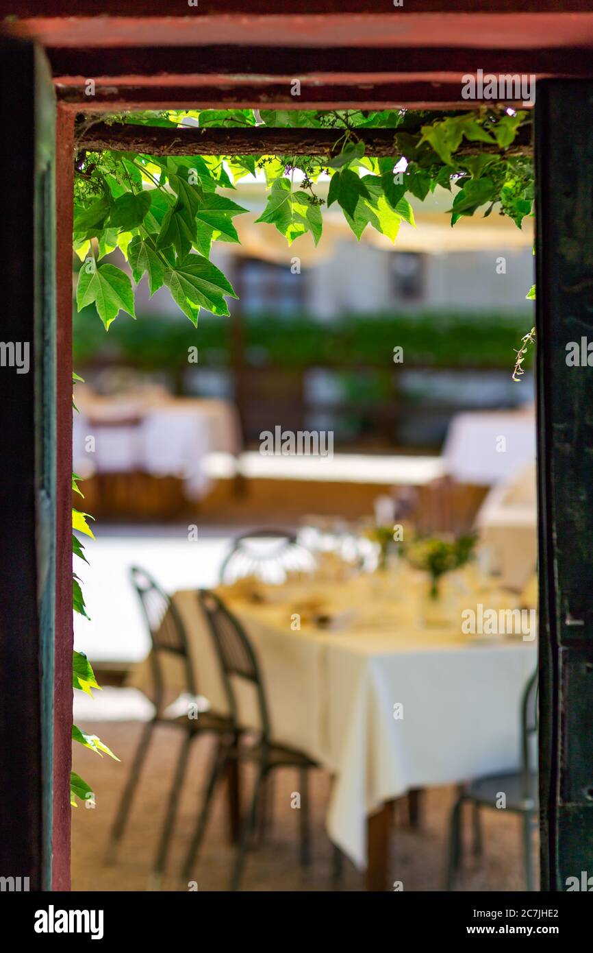 Vertical selective focus shot of an outdoor restaurant setting Stock ...
