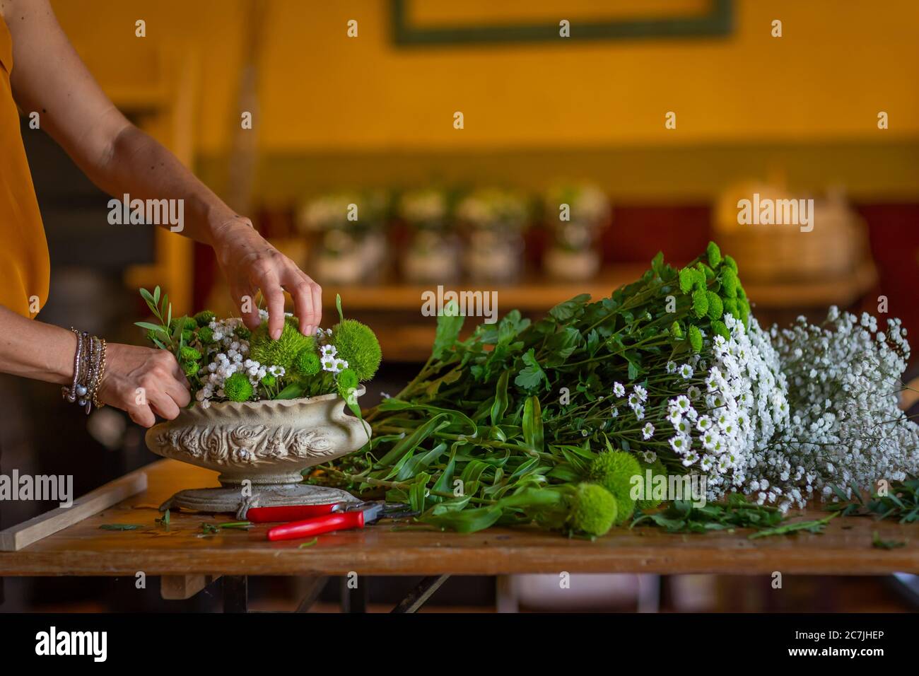 Selective focus shot of a florist making a flower composition Stock Photo - Alamy