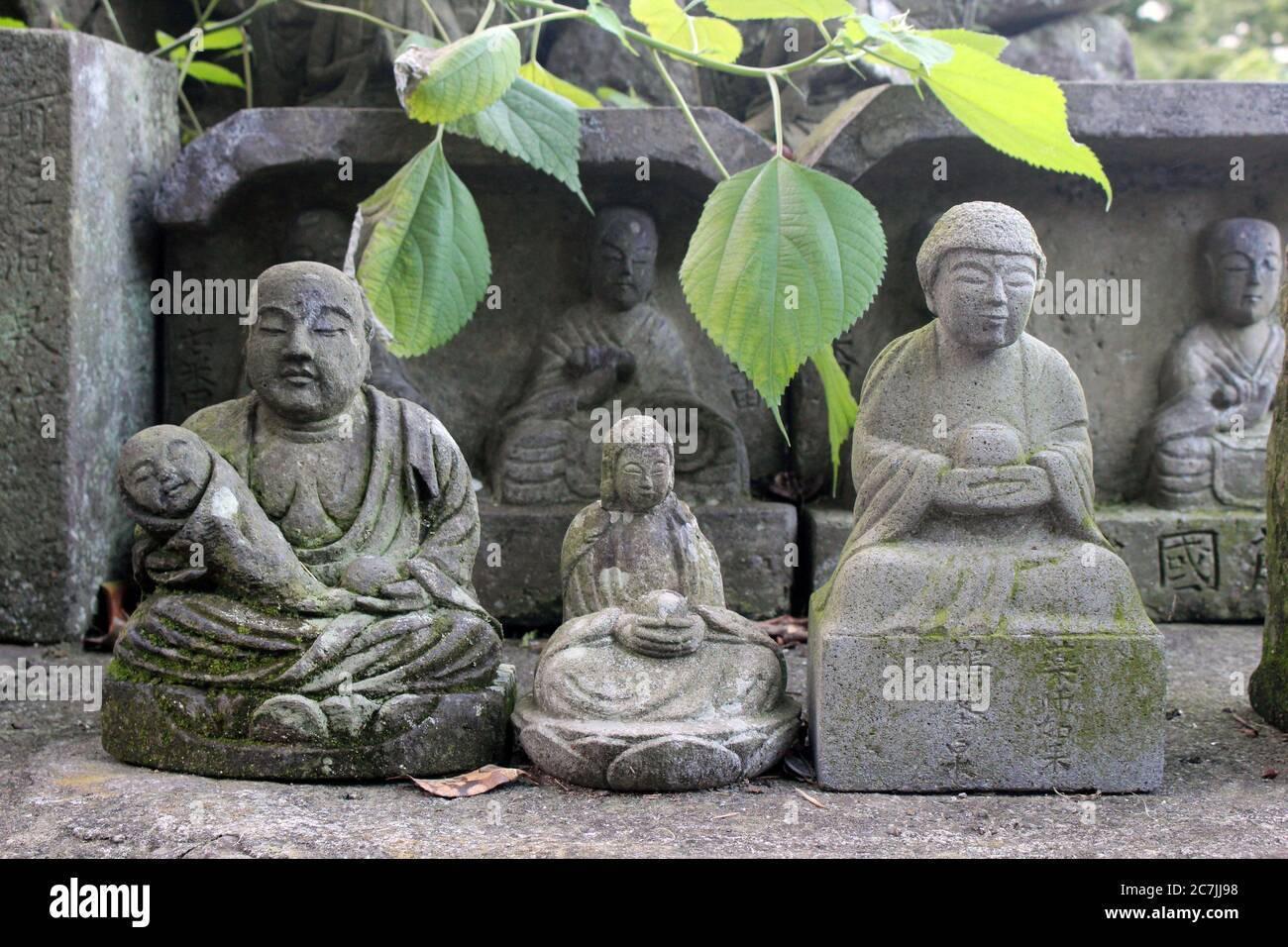Statue of Buddha and Jizo at a Japanese temple Stock Photo - Alamy