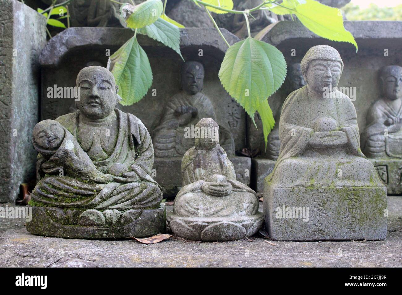 Statue of Buddha and Jizo at a Japanese temple Stock Photo - Alamy