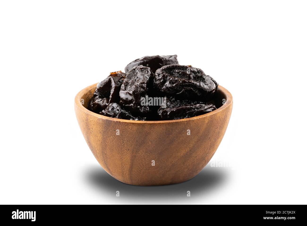 Dried pitted prunes in wooden bowl on white background with clipping ...