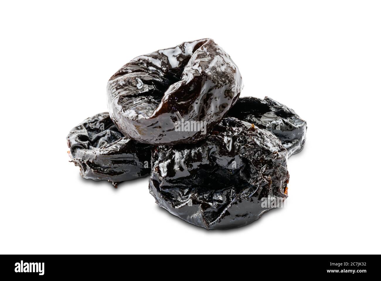 Pile of dried pitted prunes on white background with clipping path ...