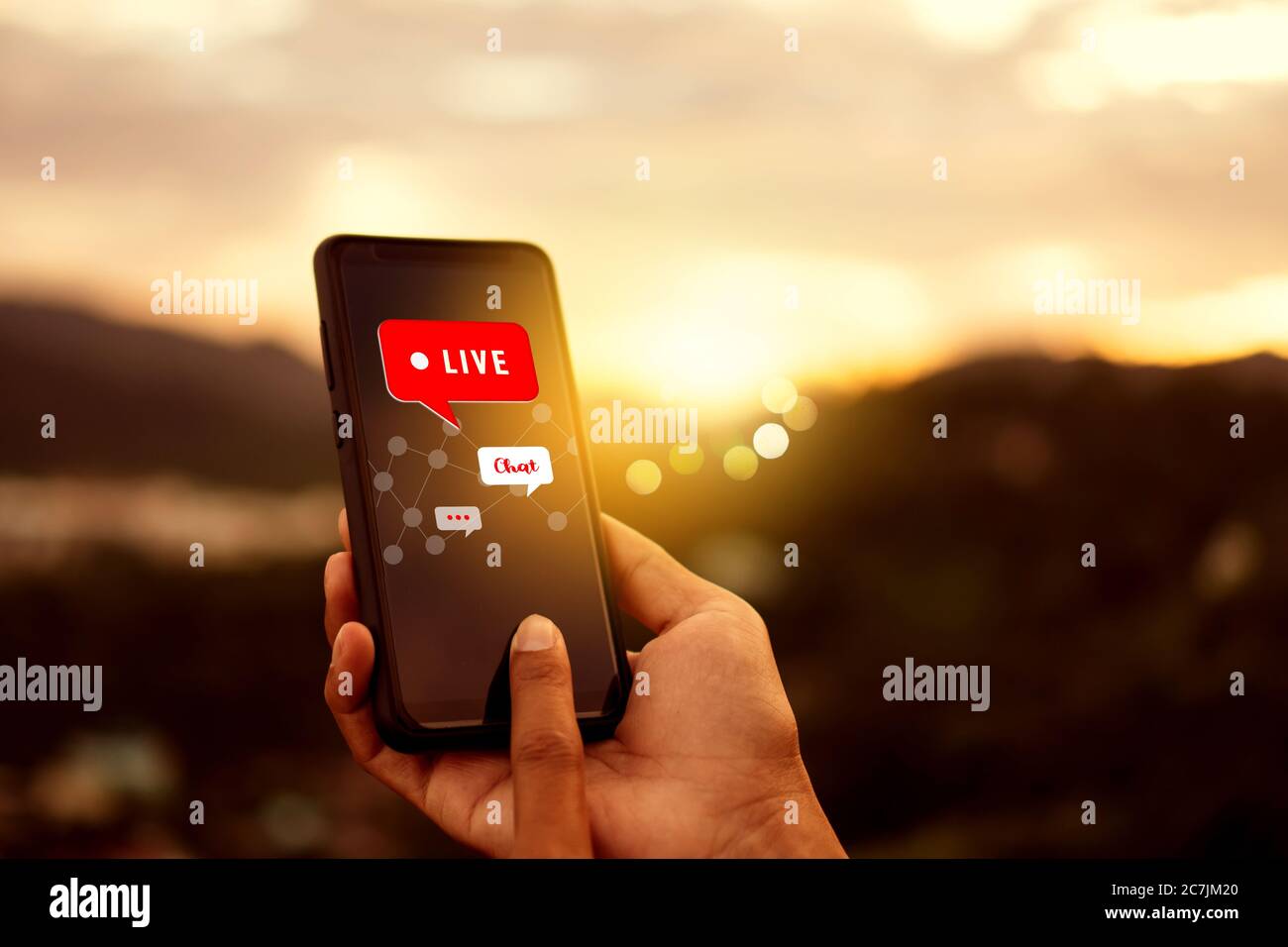 Woman hand using smartphone with live record and chat icon on screen ...