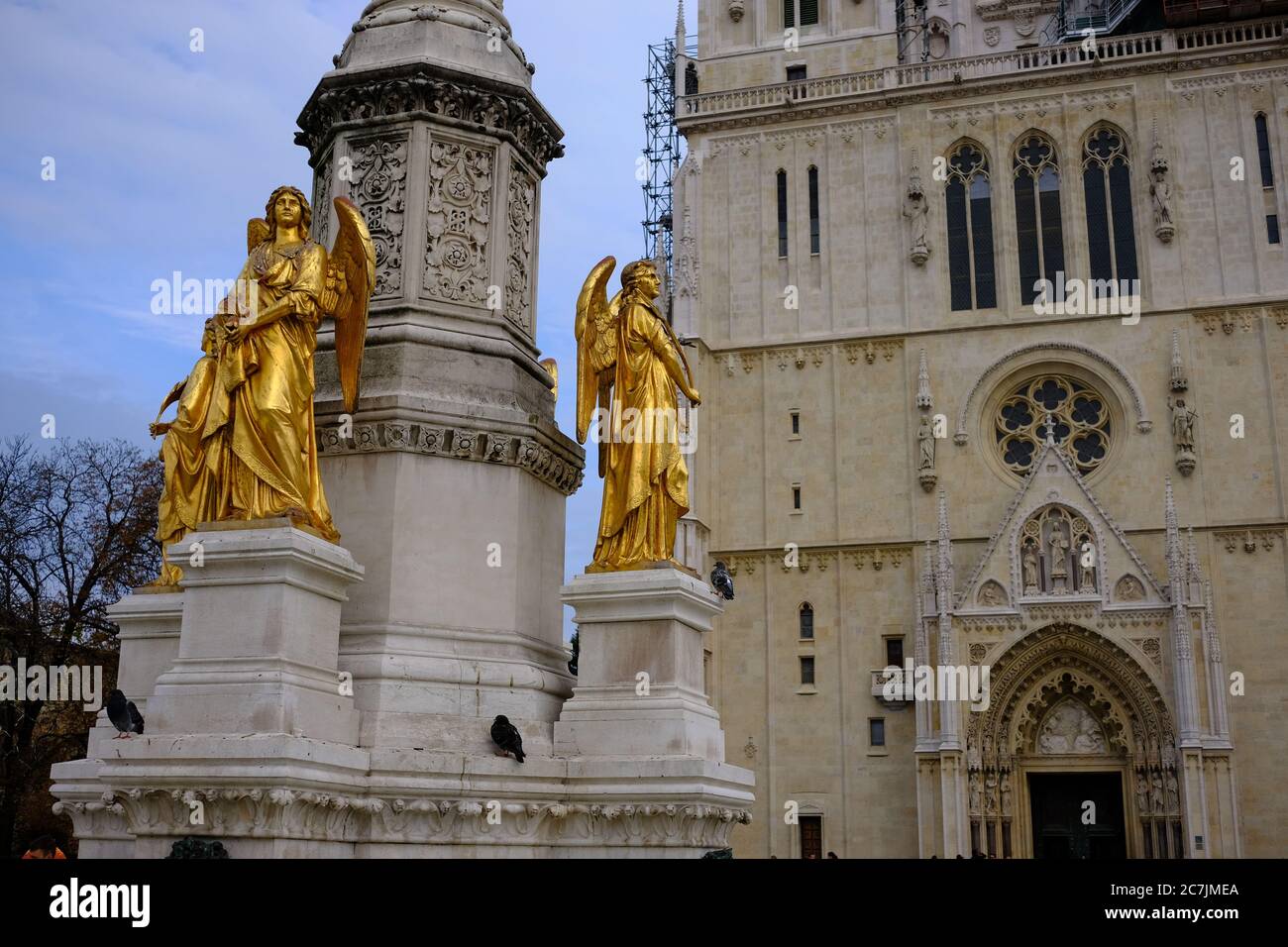 golden statues in front of a church in europe Stock Photo - Alamy