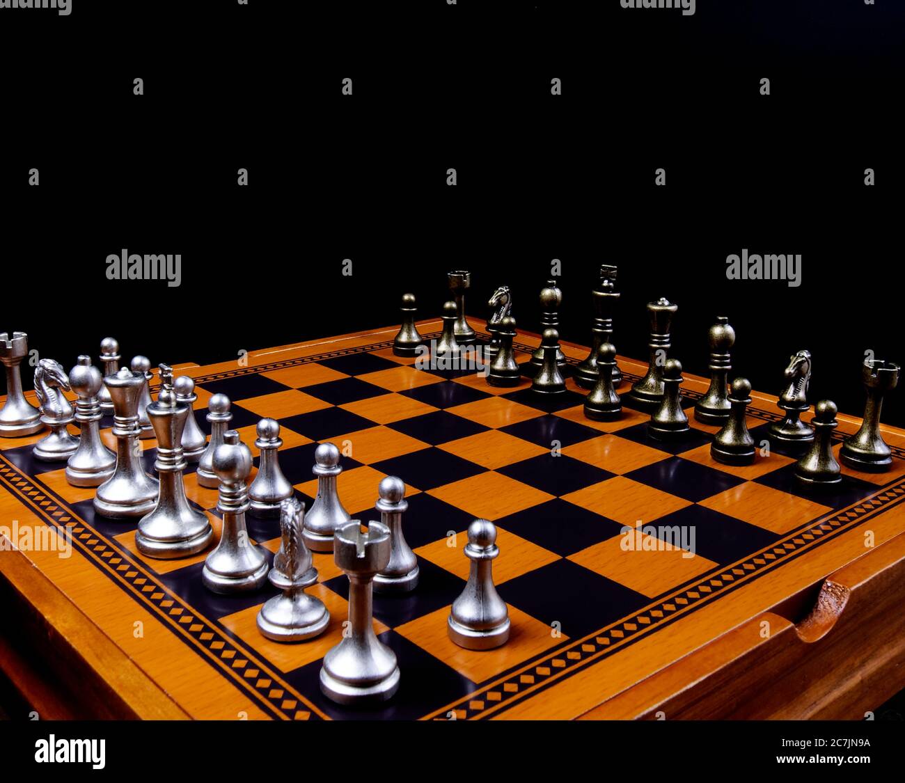 Chess Pieces on Chess Board with Dark Background Stock Photo - Alamy