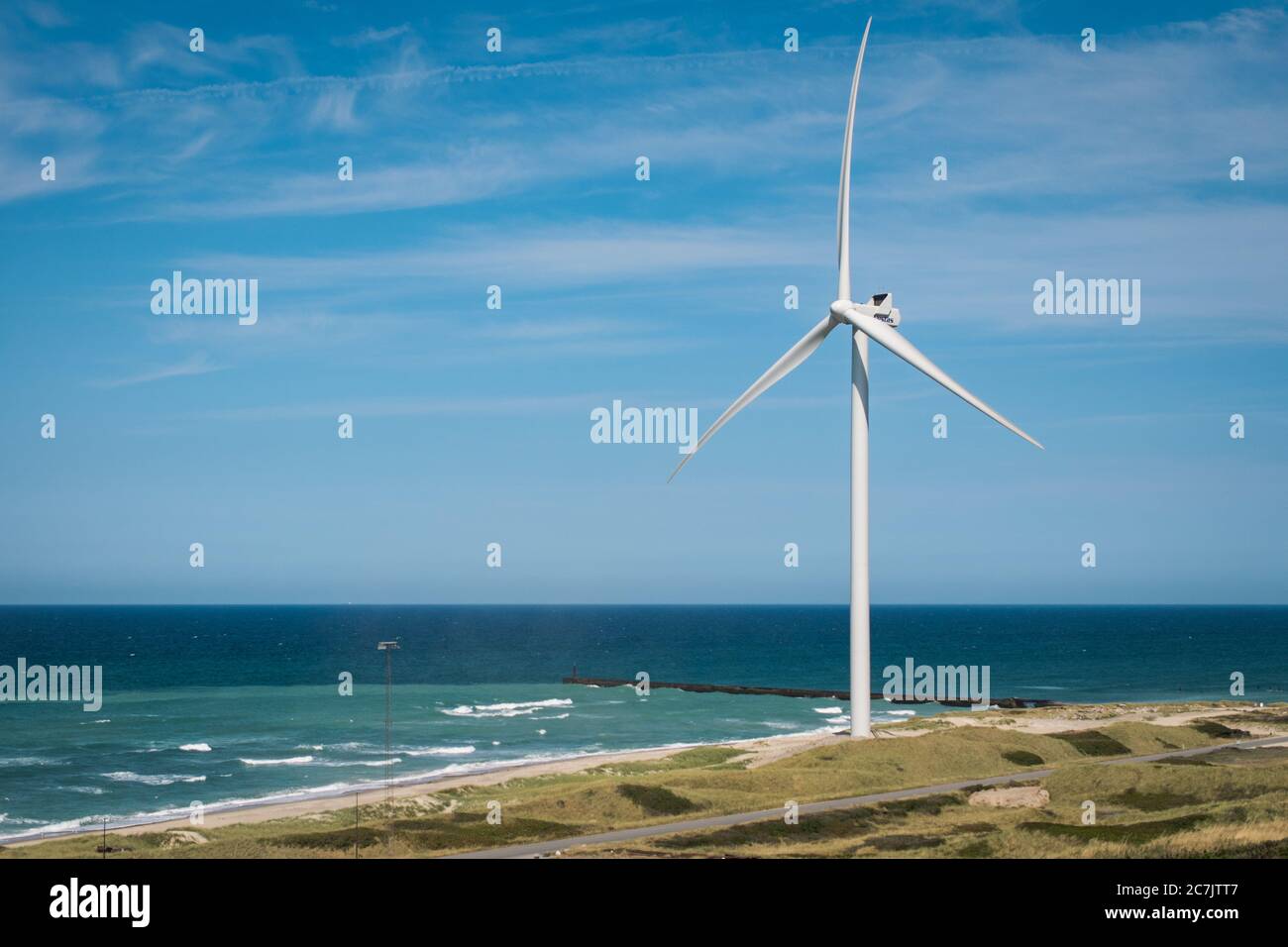 Windmill on the beach near the beautiful sea under the cloudy sky Stock ...