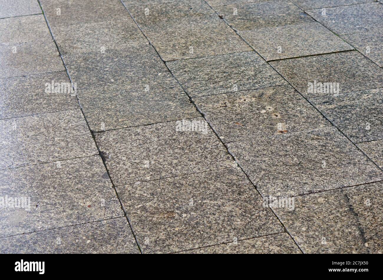 High angle shot of the square tiles of a cobblestone ground Stock Photo ...