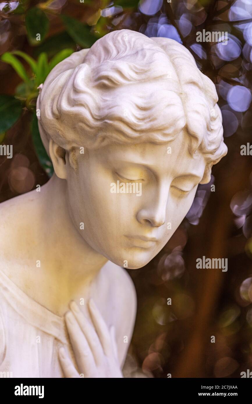 Sculpture grieving woman weathered historic hi-res stock photography ...