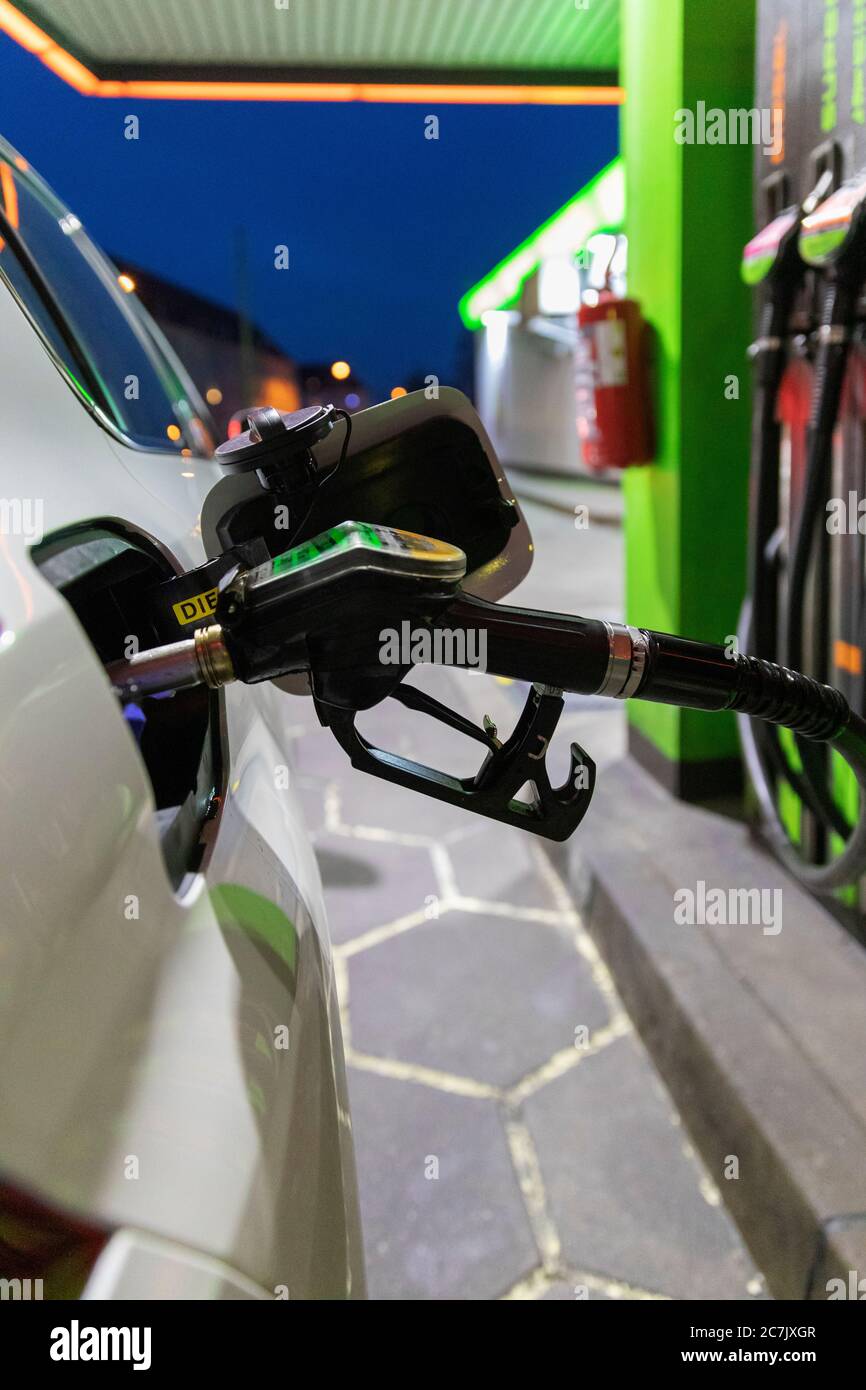 In the evening, the car is filled with diesel fuel, tap, filler neck ...