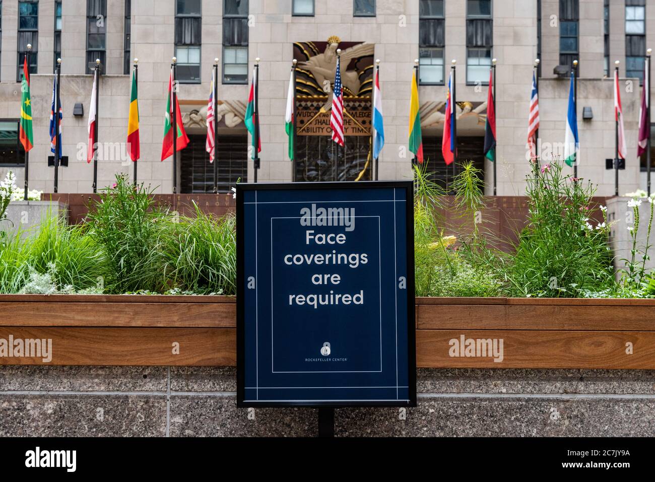 A sign outside the Rockefeller outdoor seating area reminds visitors ...