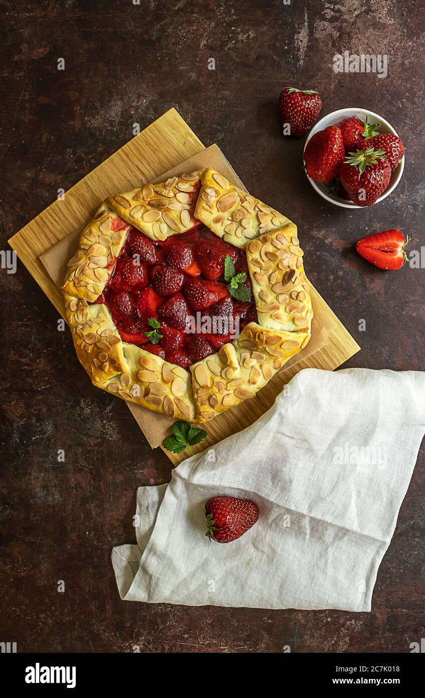 Vertical flat lay of homemade strawberry open pie galette Stock Photo ...