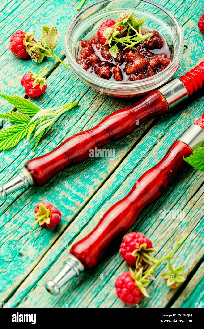Oriental smoking hookah with tobacco with the aroma of raspberry jam ...