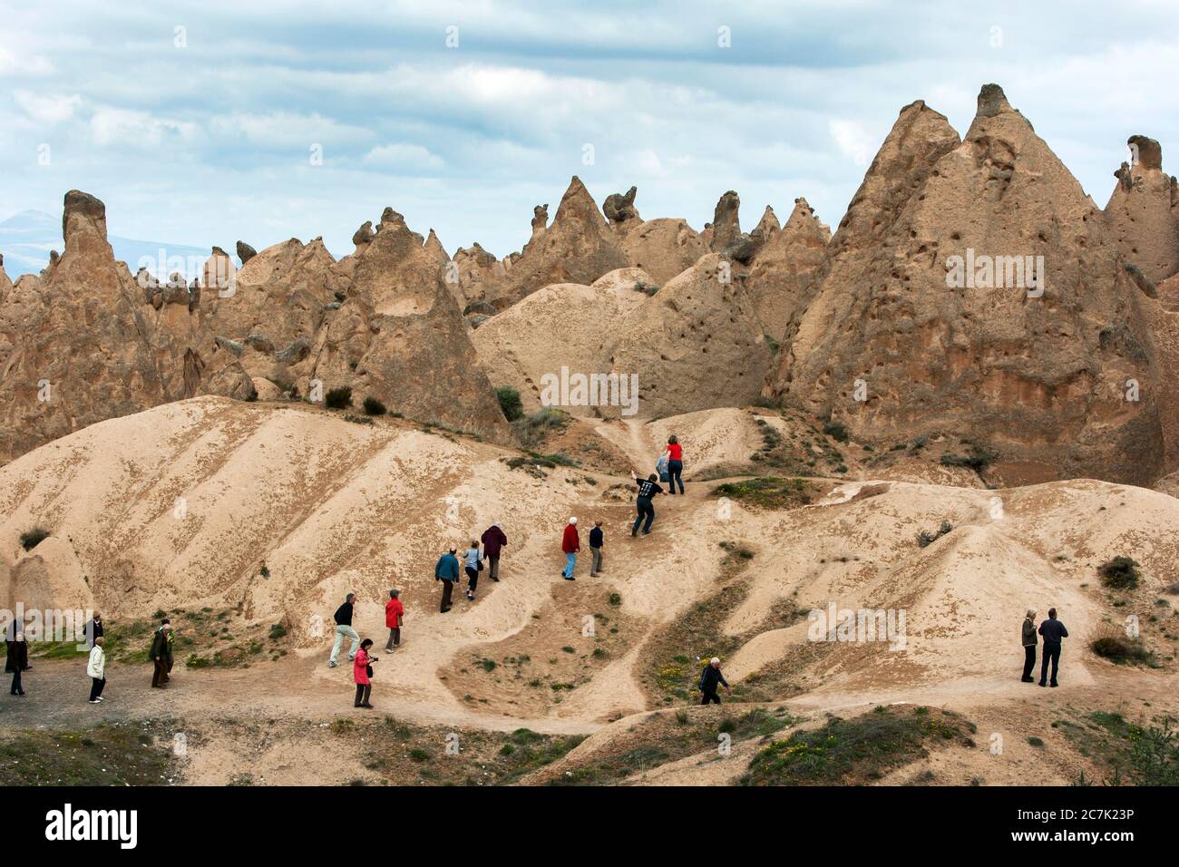 Tourists look over the magnificent fairy chimney landscape of the ...