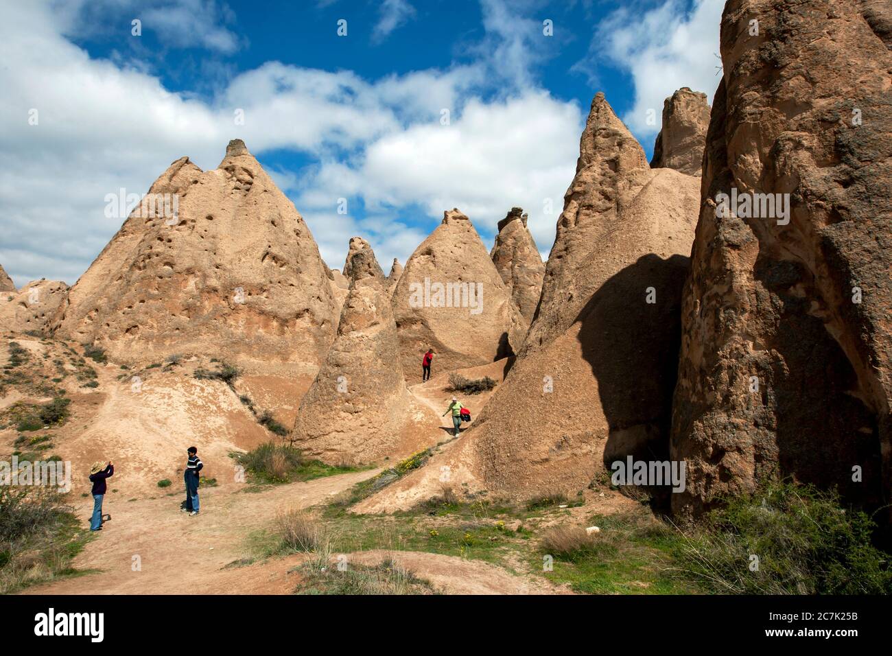 Tourists look over the magnificent fairy chimney landscape of the ...