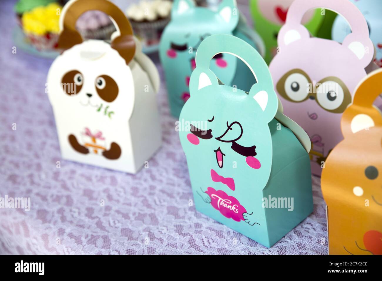 Closeup of colorful candy boxes with characters printed on them under ...