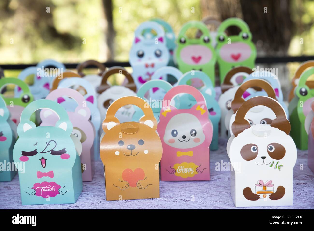 Closeup of colorful candy boxes with characters printed on them under ...