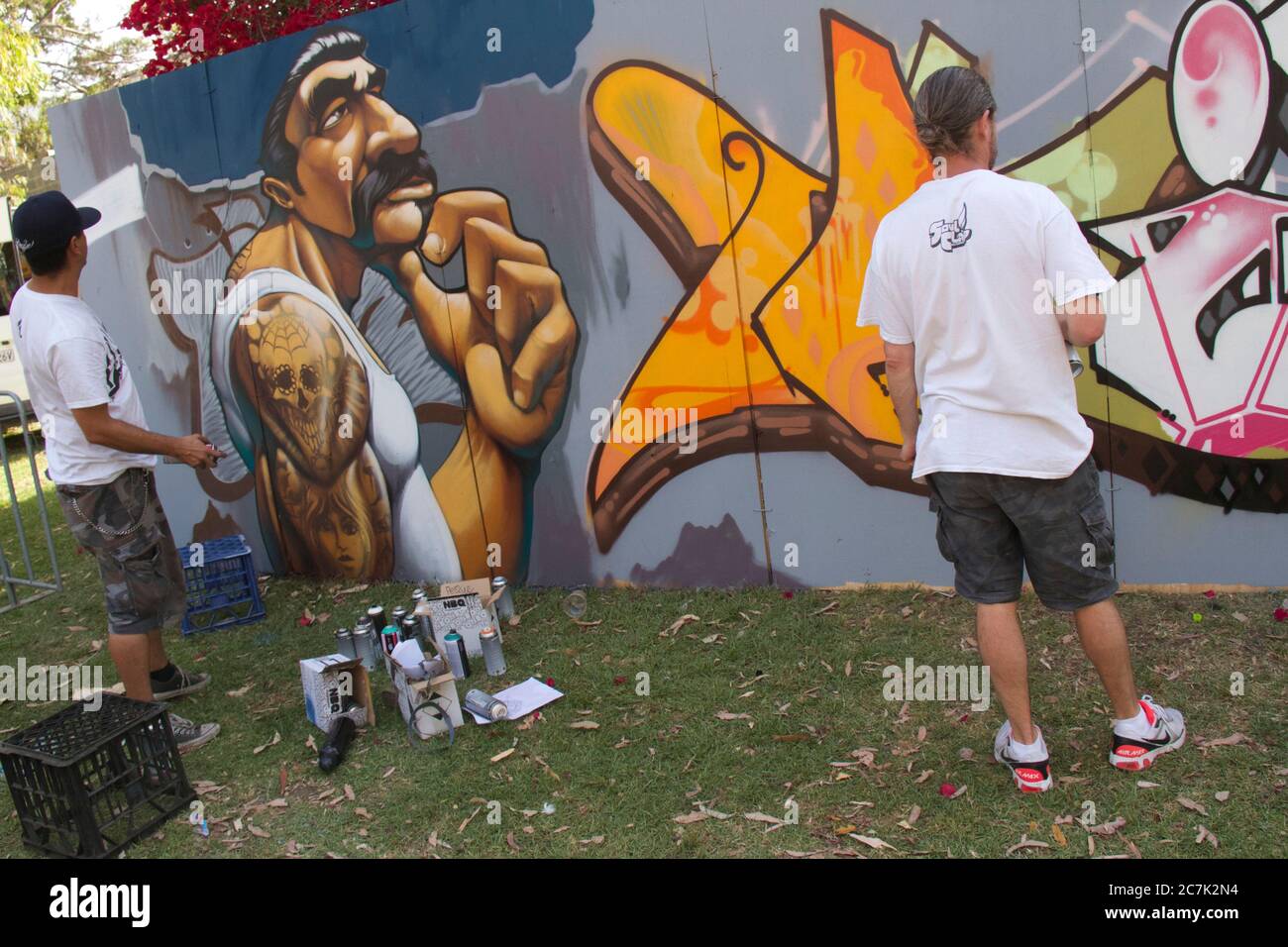 Graffiti Artists Phibs, Peque and Unique decorated a wall at the Live ...