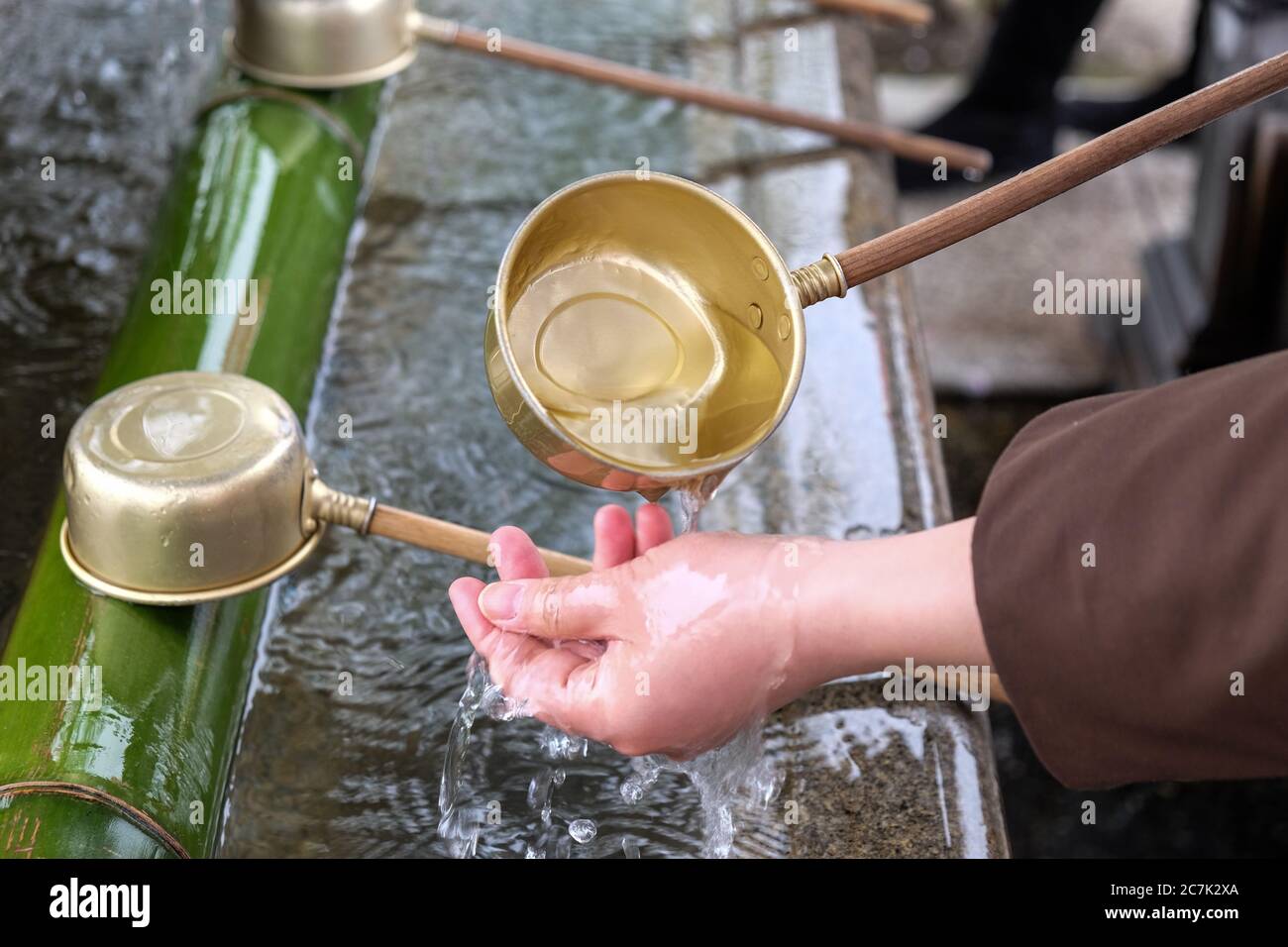 Person washing hands with saint water in a Japanese temple, Tokyo Stock ...