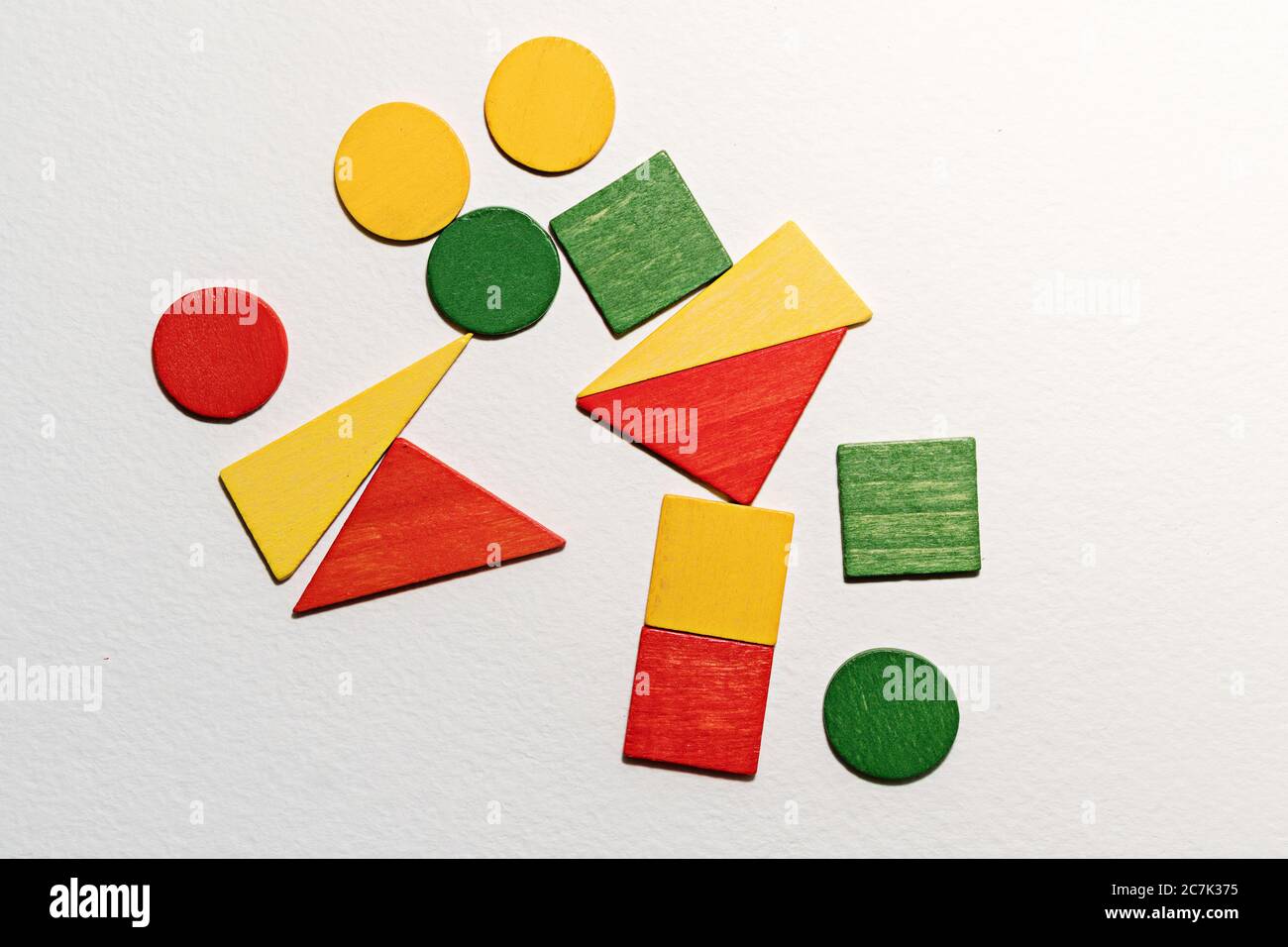 Different colorful shapes wooden on white background. Geometric shapes ...