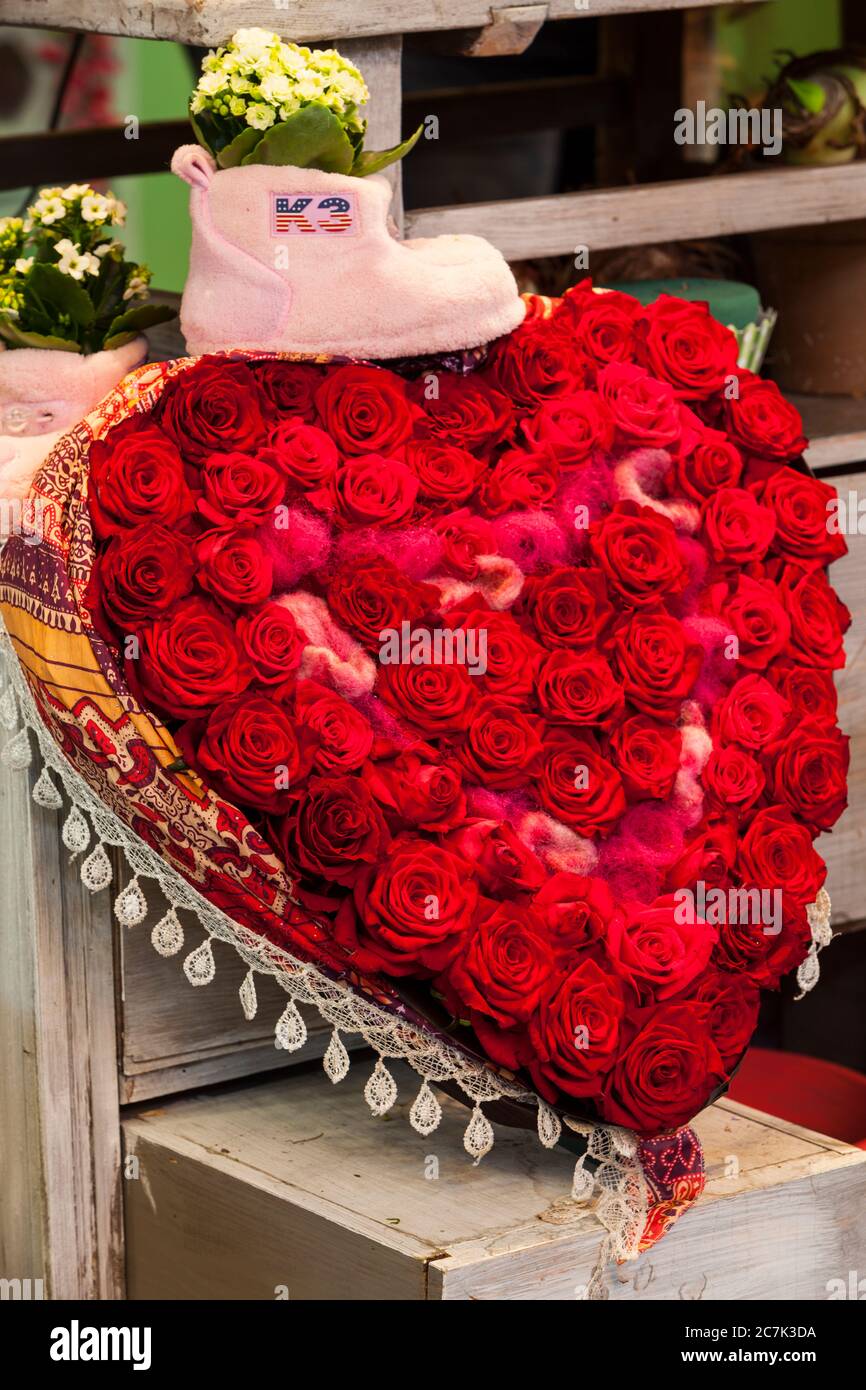 Flower arrangement, Heart with red roses Stock Photo - Alamy