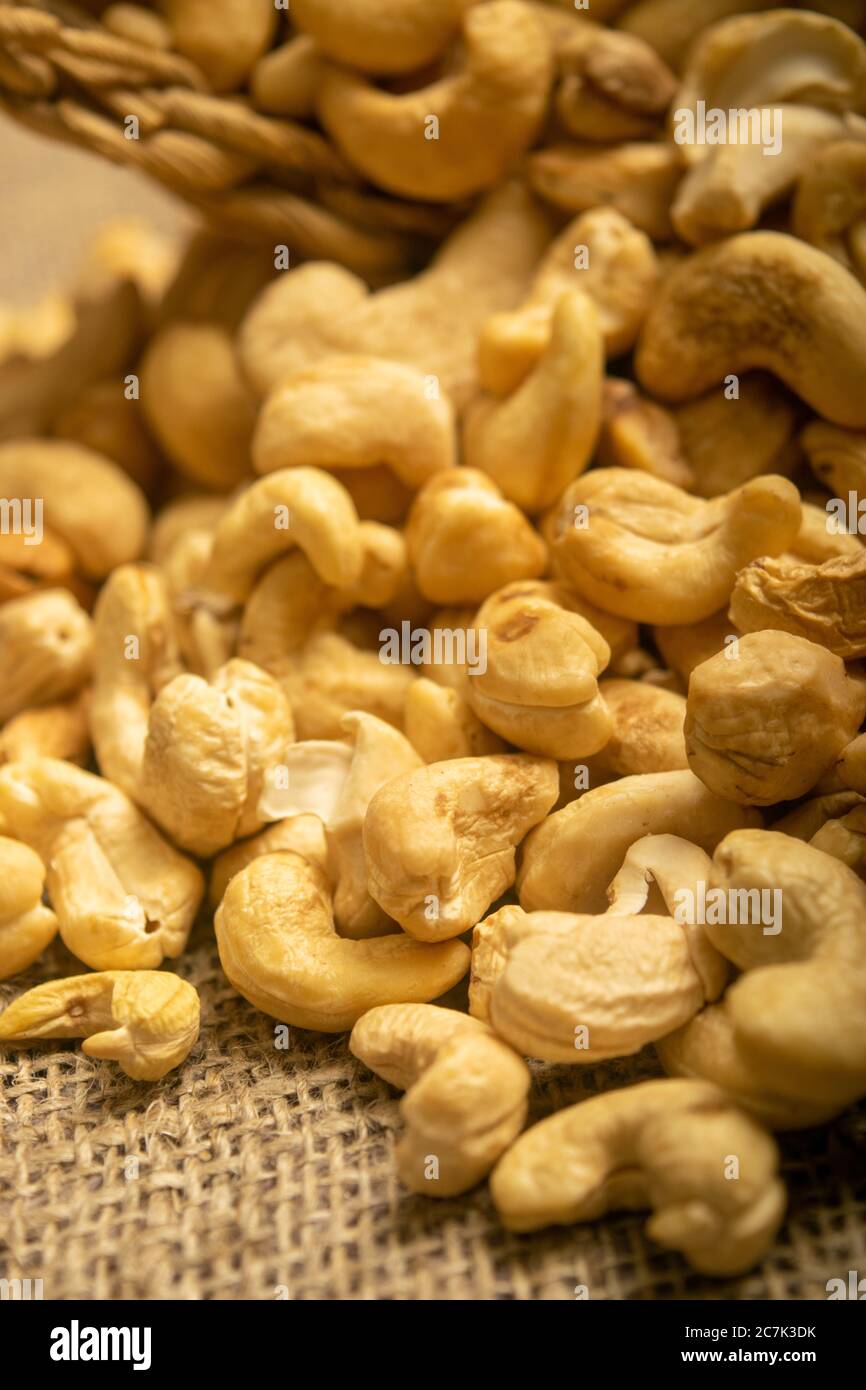 A pile of cashew nuts on burlap with a rough texture surface texture ...