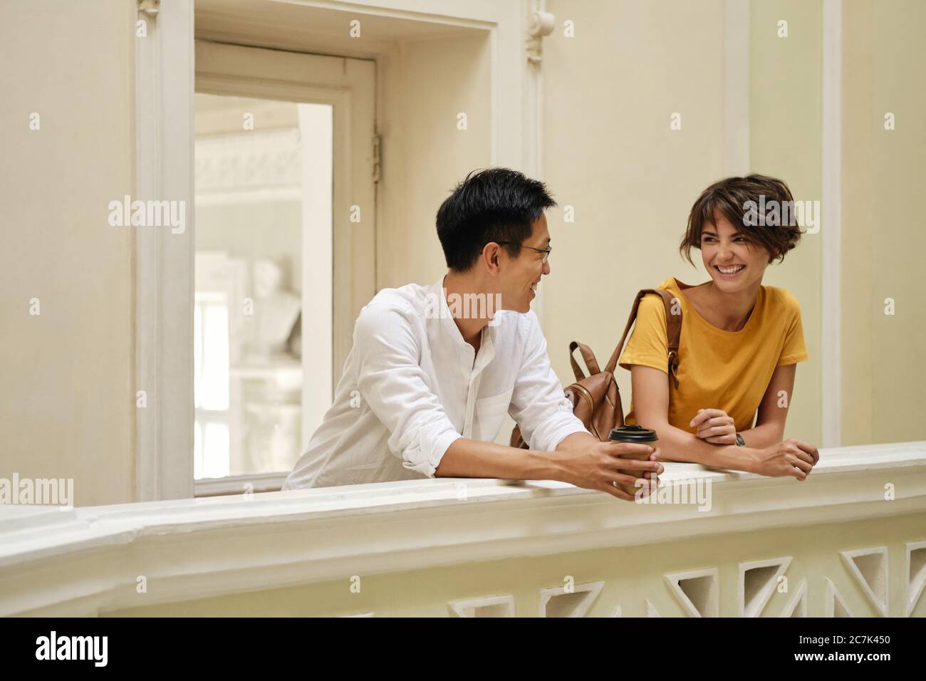 Stylish multinational young students talking hi-res stock photography ...