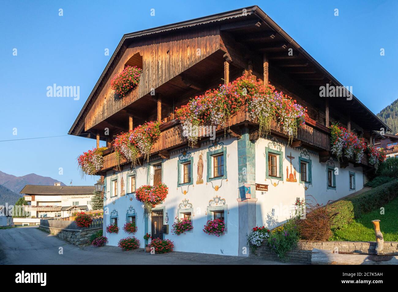 Obertilliach, typical facades of historic houses with decorations and ...