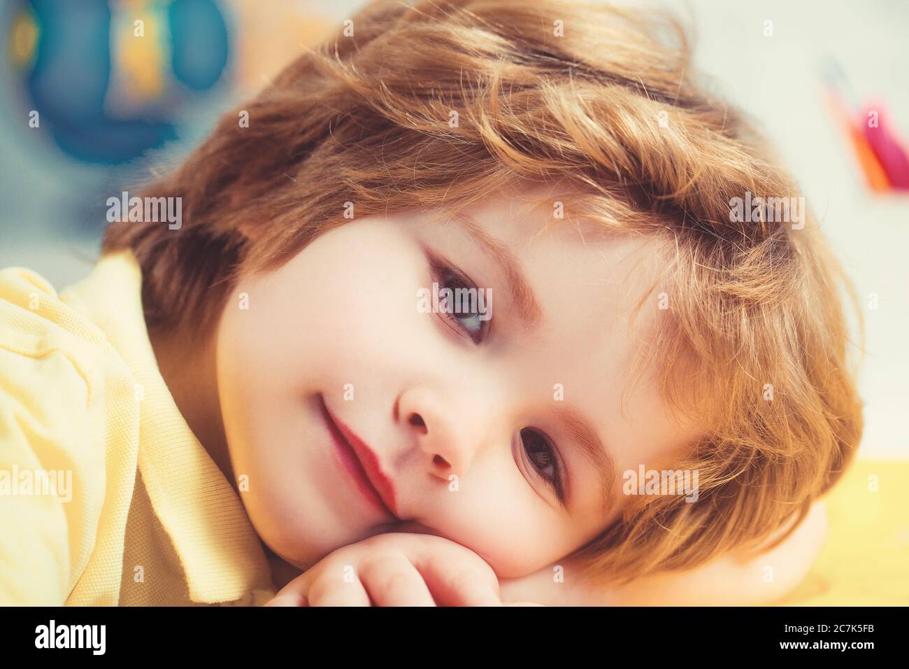 European boy with brown eyes looking directly at the camera, close-up ...