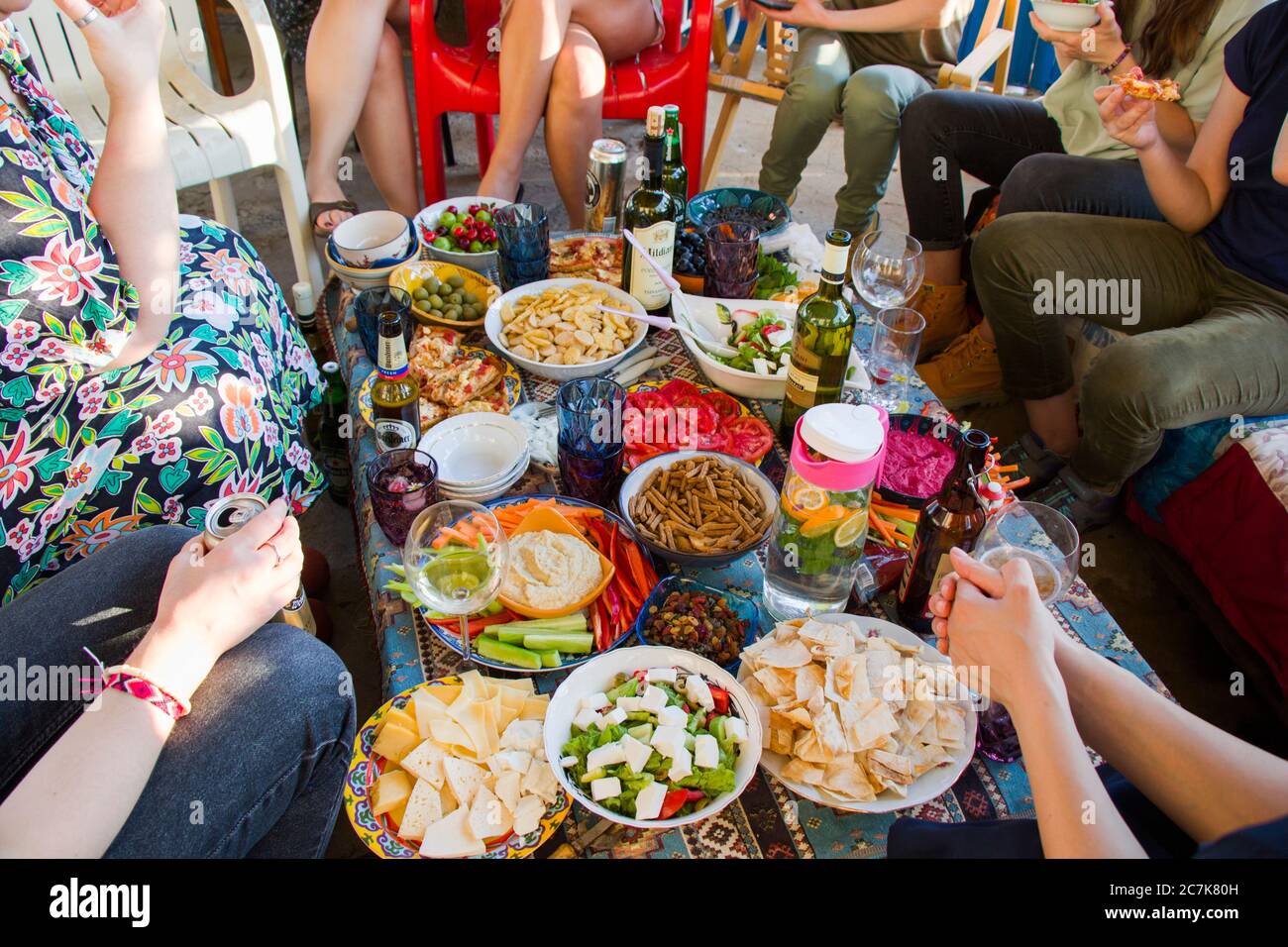 Full table view, people hands and eating process. Friends at the table ...