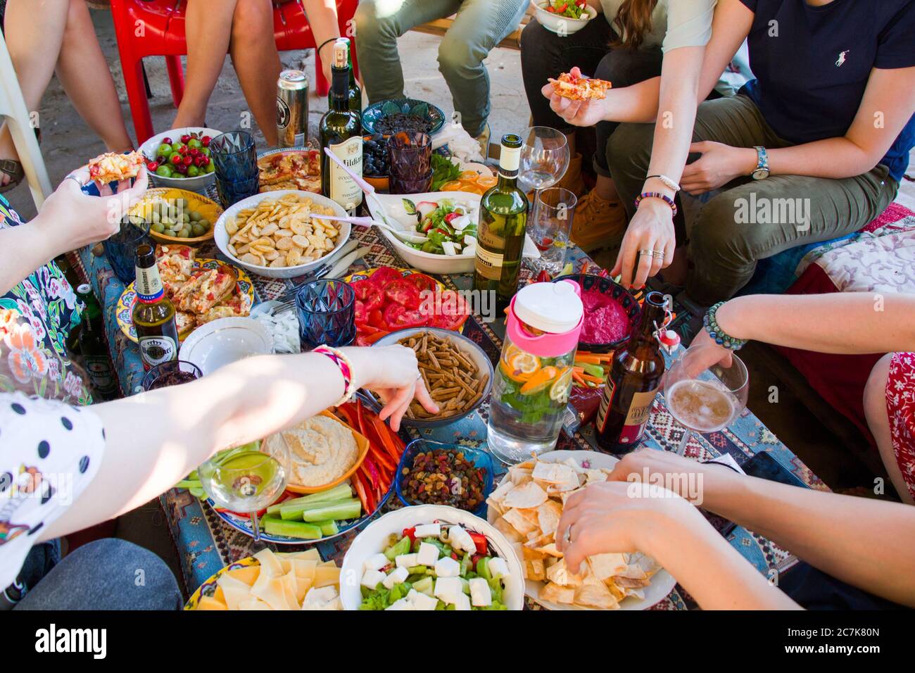 Full table view, people hands and eating process. Friends at the table ...