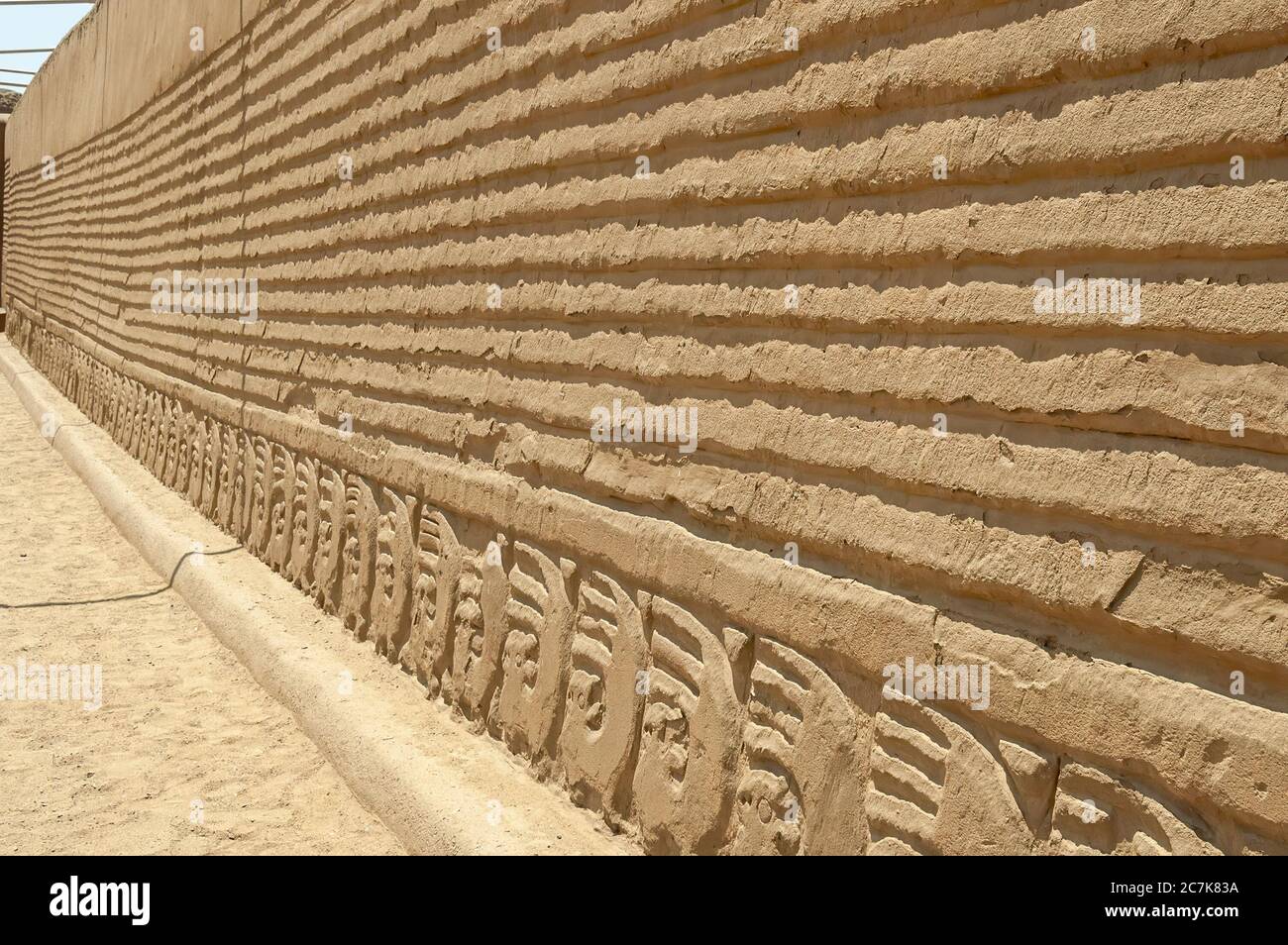 Detail of an adobe wall with a animal symbol design in the Chan Chan ...