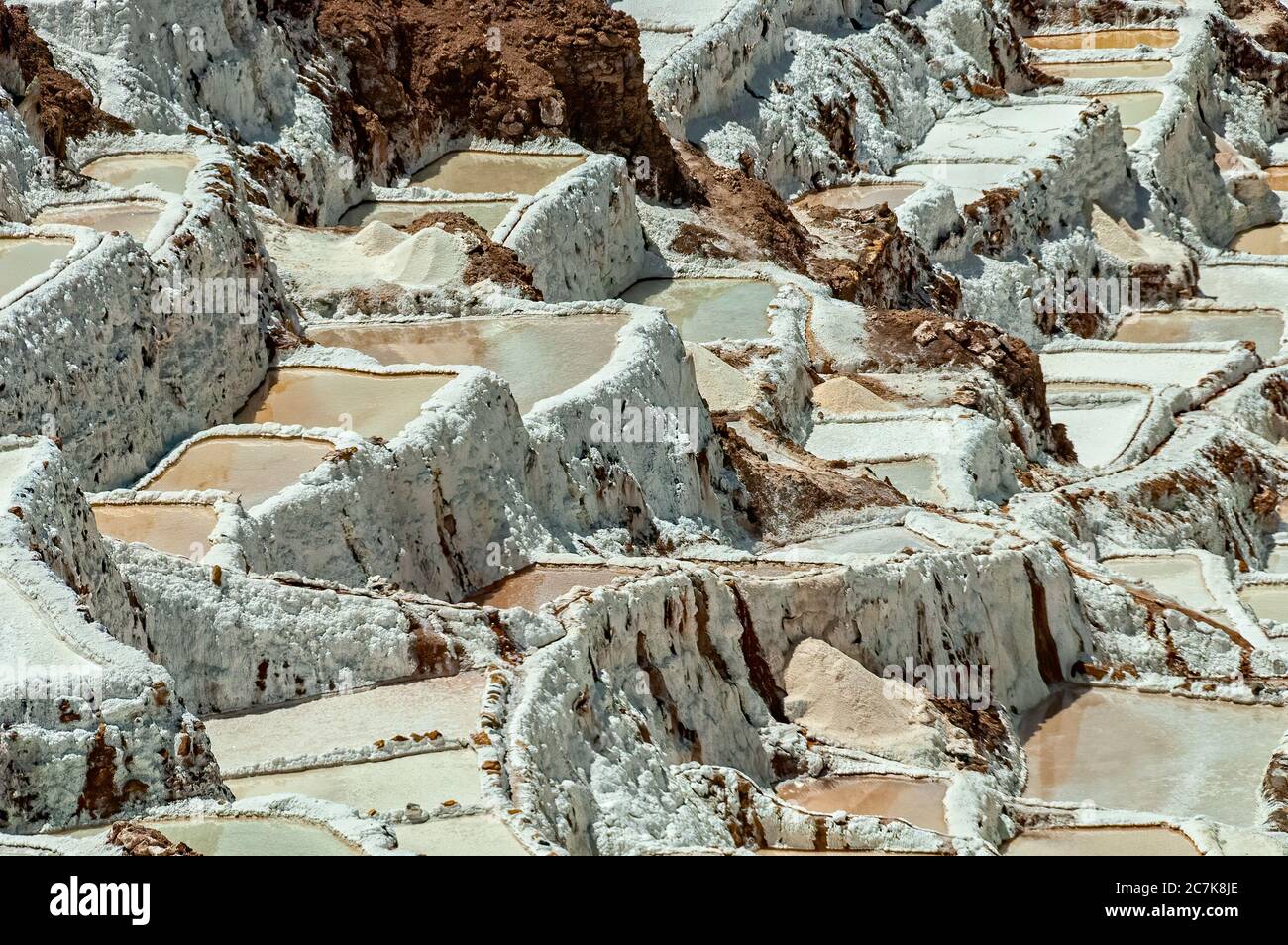 Salt evaporation ponds at the Maras salt mine in the Cuzco region of ...