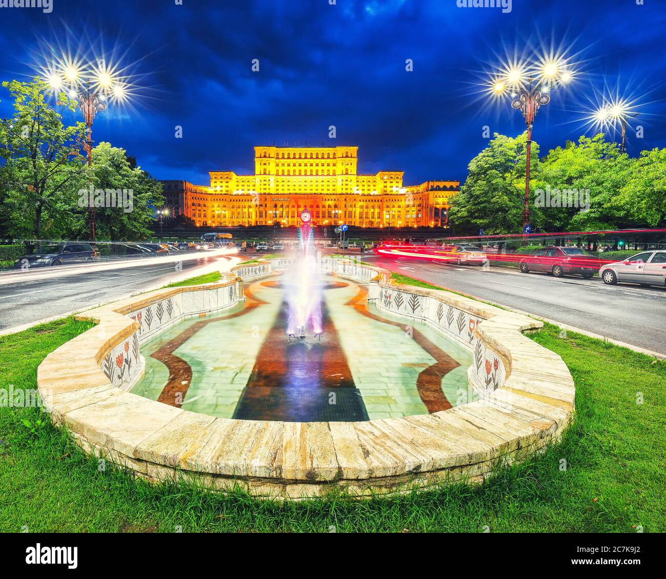 Illuminated Palace of the Parliament of Bucharest at night. Dramatic ...