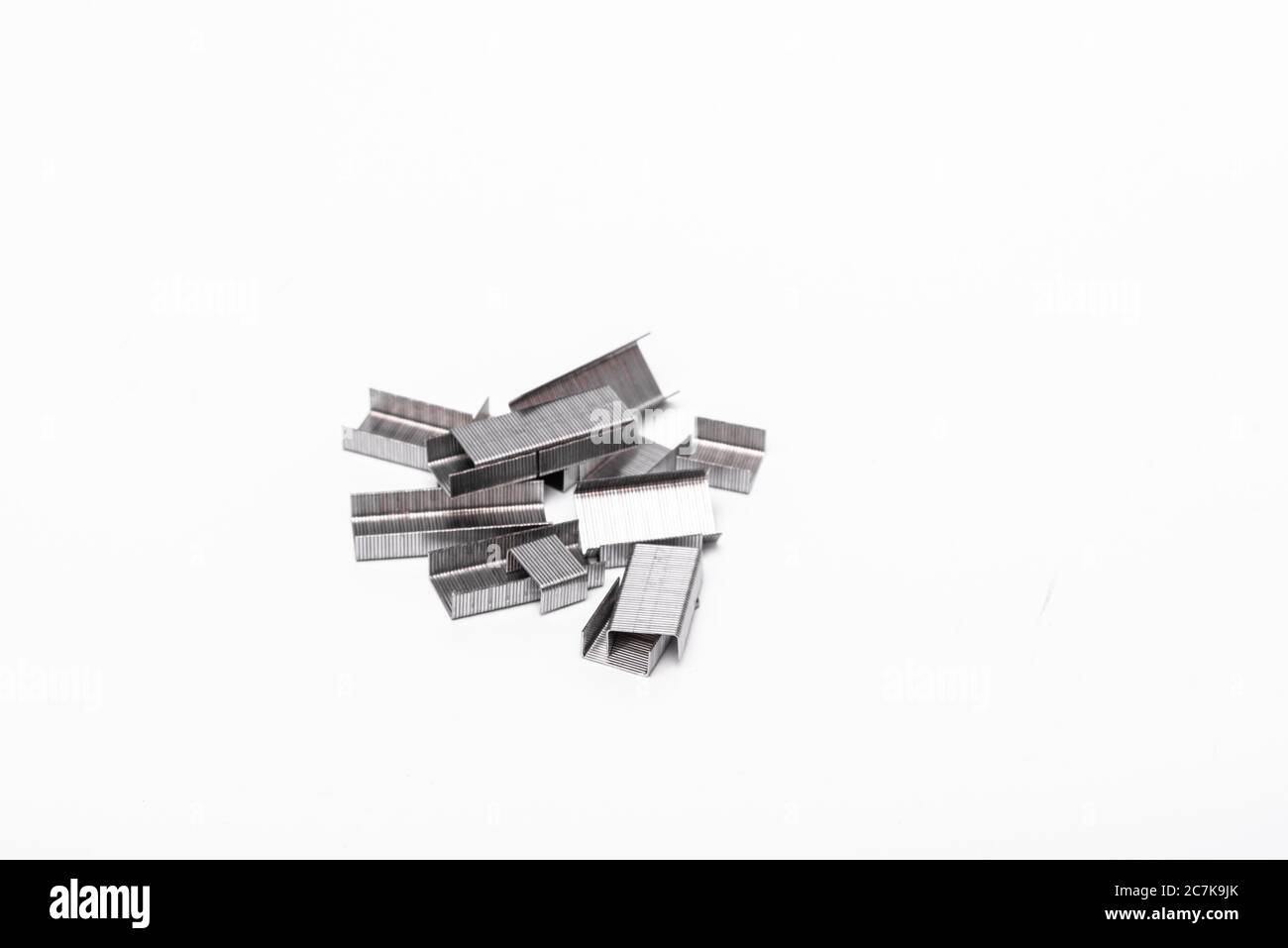 a pile of staple inserts insulated on a white surface Stock Photo - Alamy