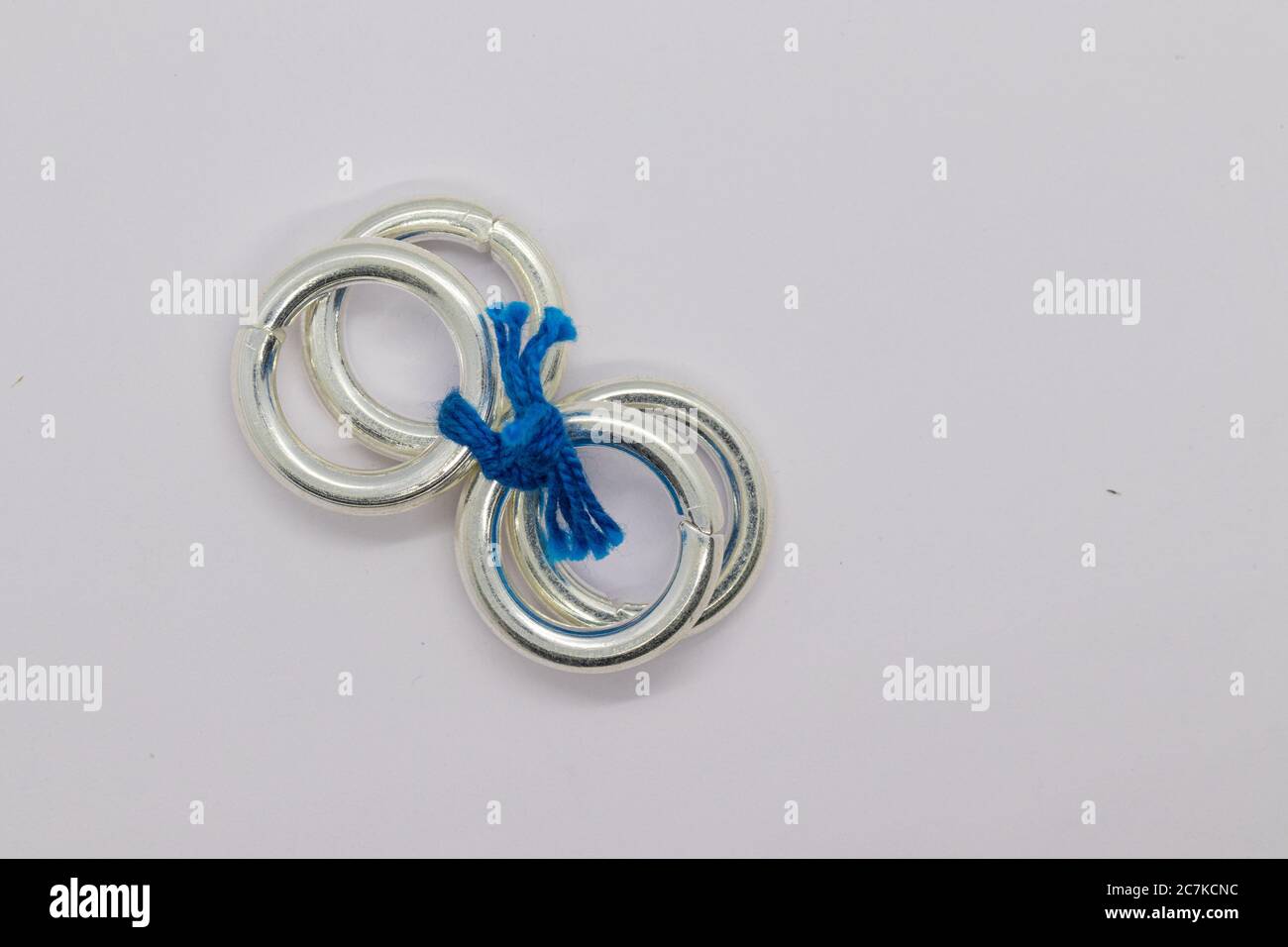 four silver leg round rings on white background Stock Photo - Alamy