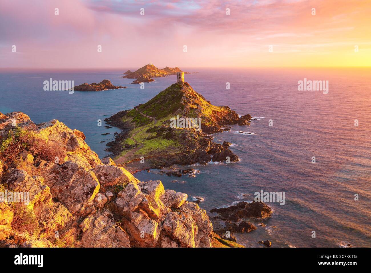Sunset over popular tourist destination Torra di a Parata with Genoese ...