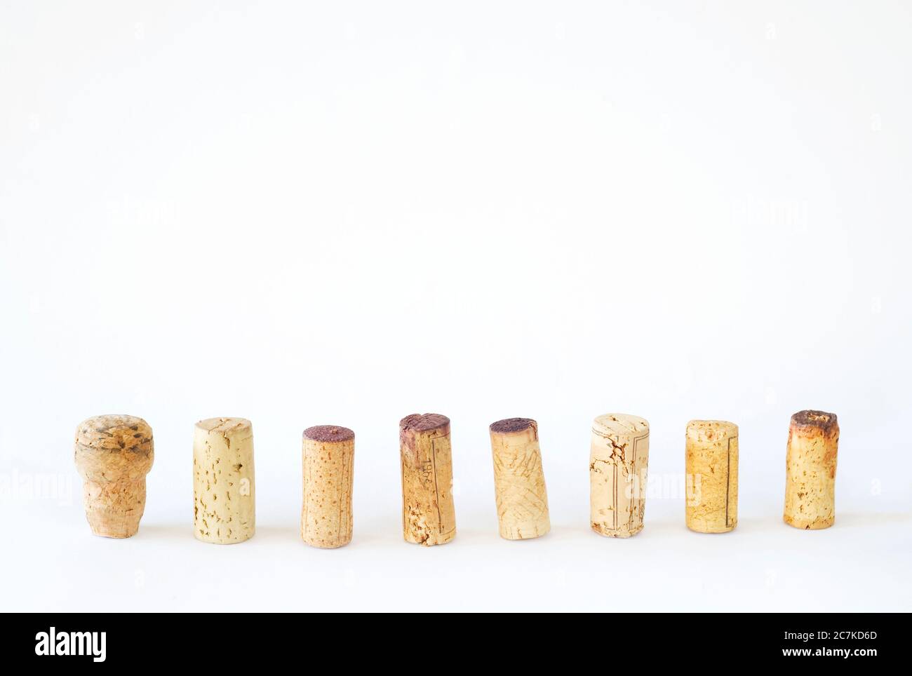 row of wine corks on white background Stock Photo - Alamy