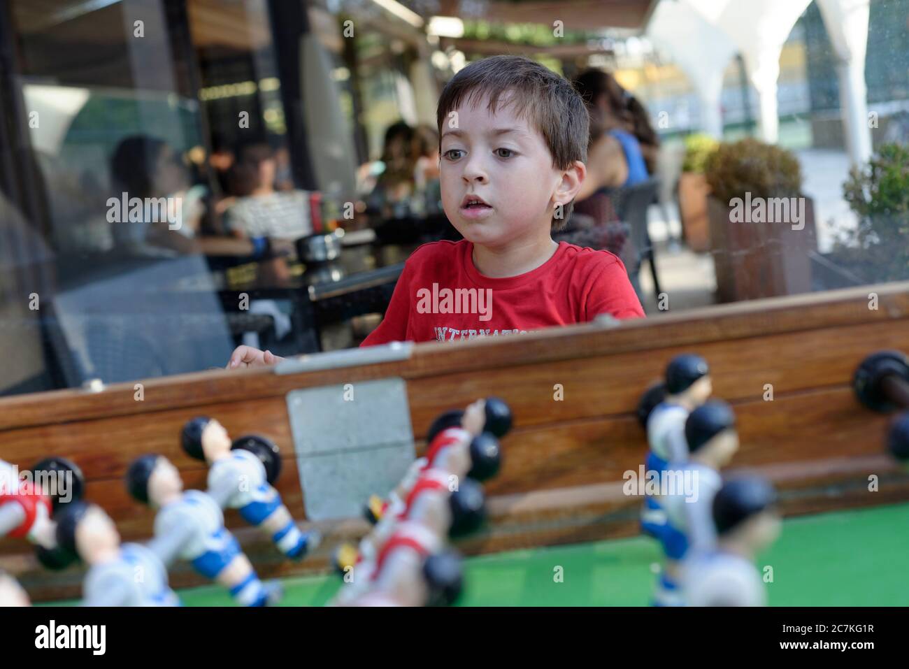 toddler playing table soccer Stock Photo - Alamy