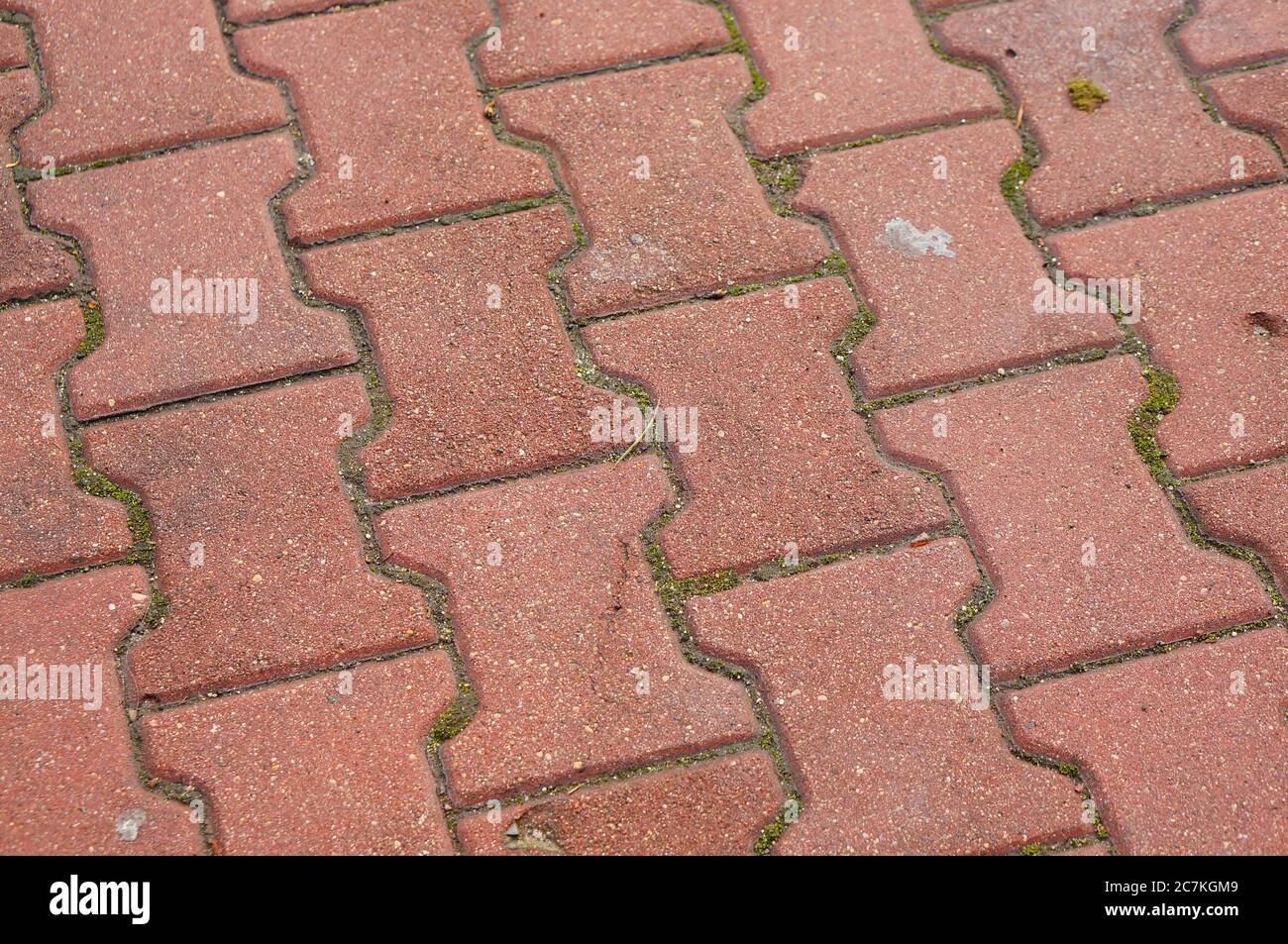 High angle shot of a patterned red cobblestone ground Stock Photo - Alamy