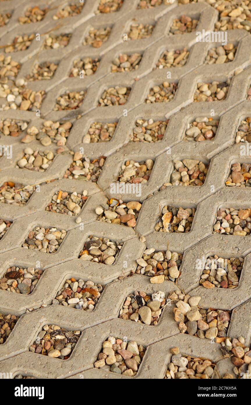 Vertical closeup high angle shot of a patterned cobblestone ground ...