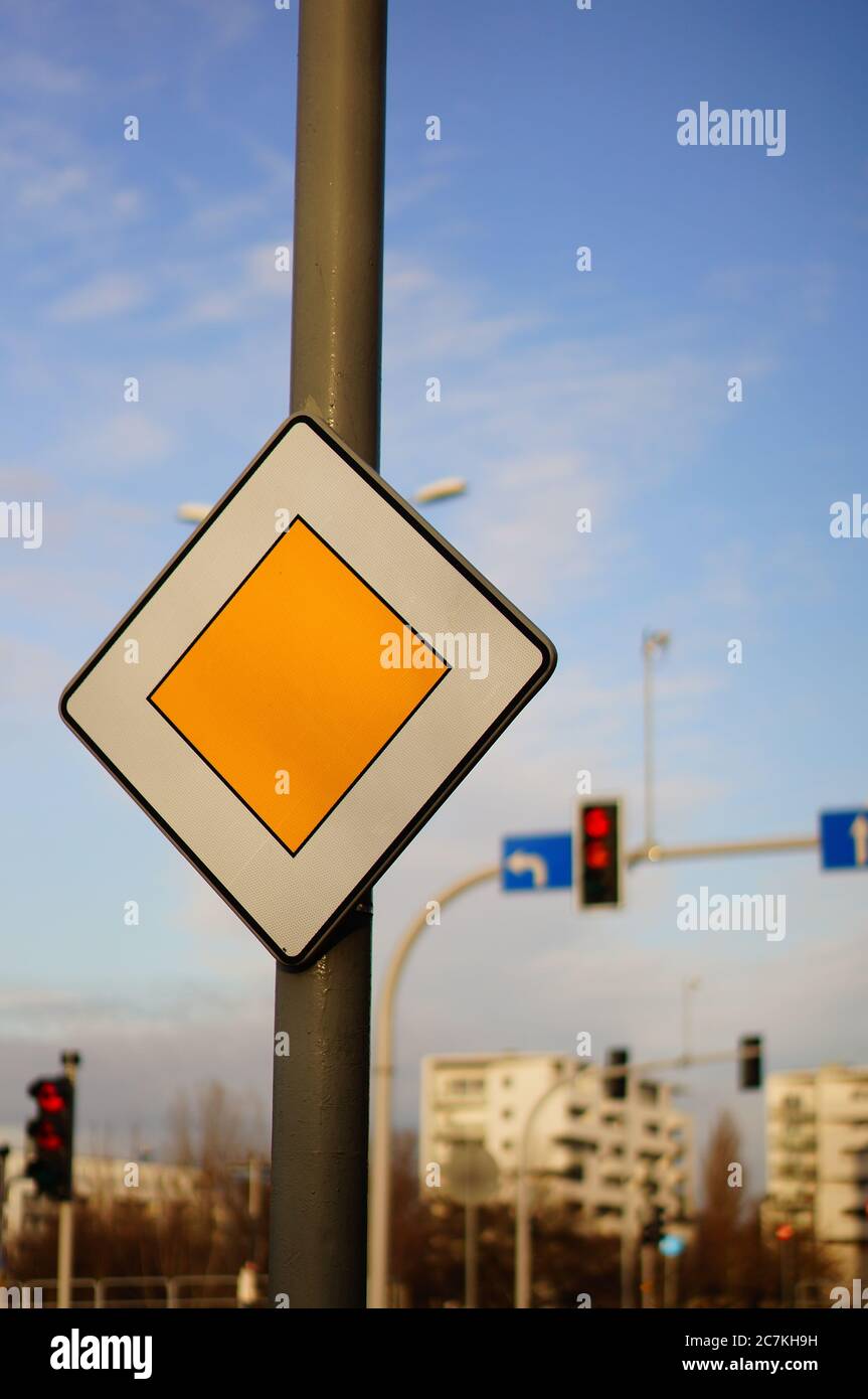 Vertical closeup shot of a road sign indicating the priority for the ...