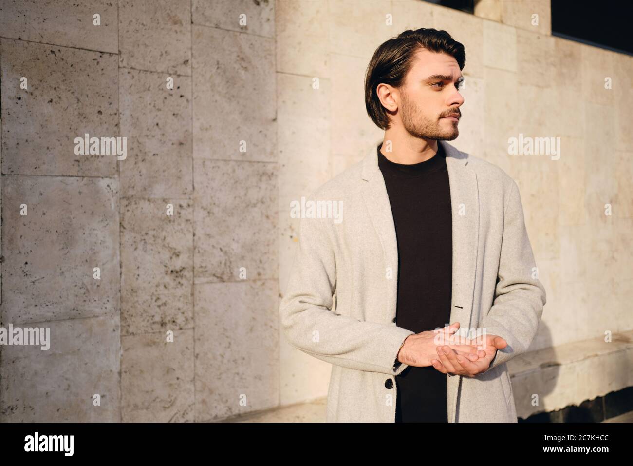 Man in winter coat side view hi-res stock photography and images - Alamy