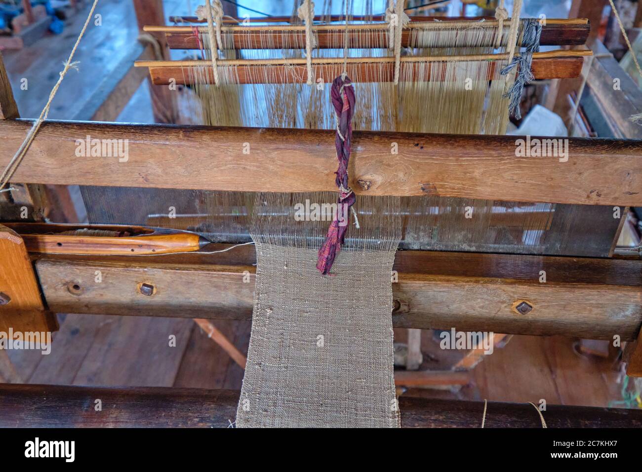 Myanmar, Inle lake: Loom at the silk factory Stock Photo - Alamy