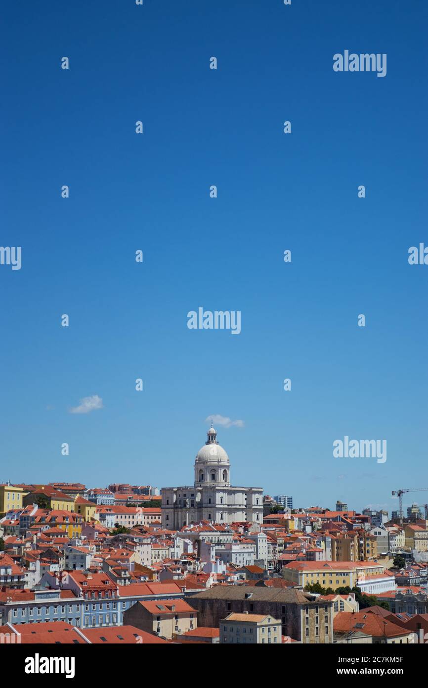 Vertical shot of a bright blue sky with The Church of Santa Engrácia ...