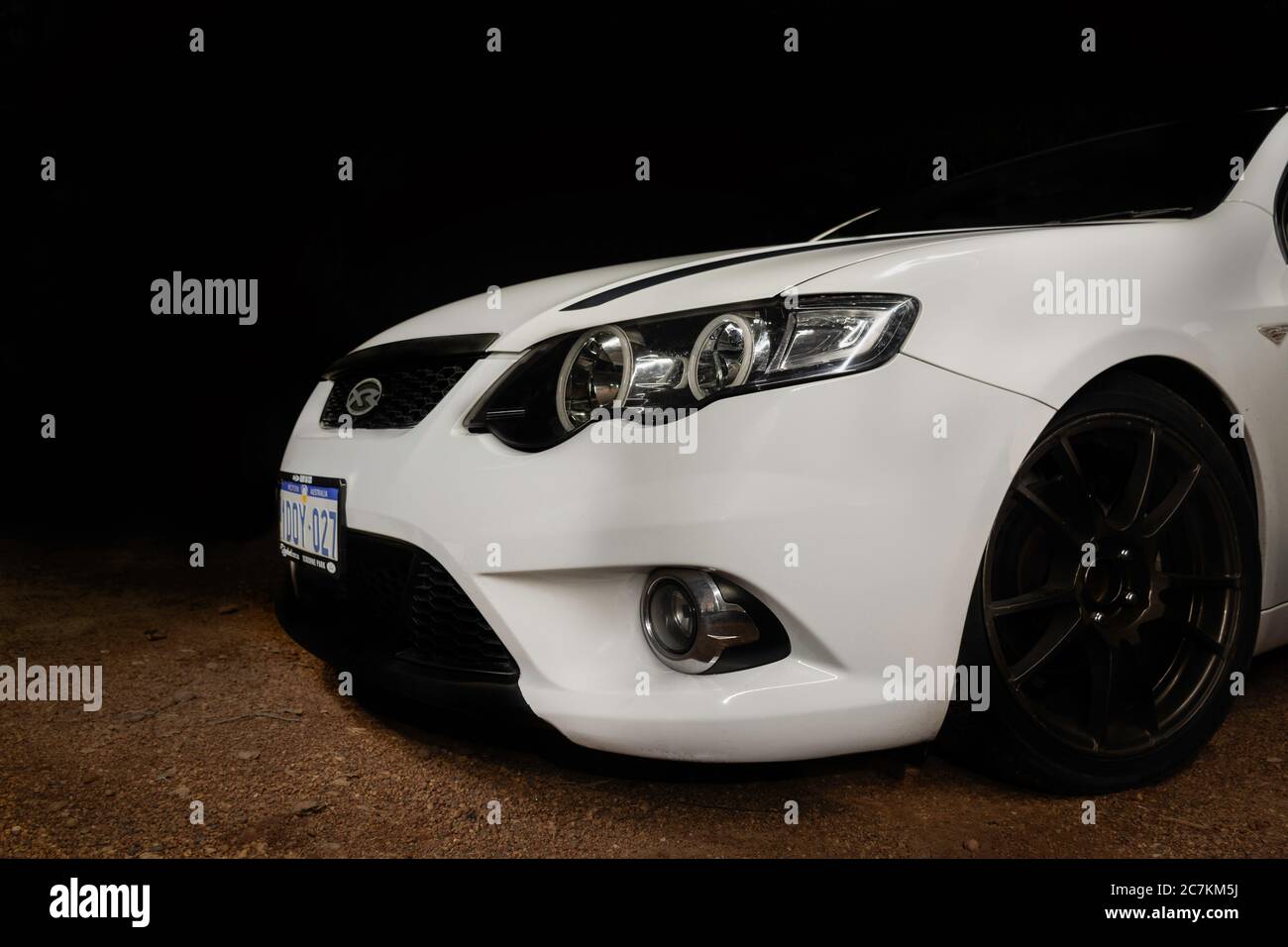 Front of White Ford Falcon XR6 FG car in the dark. Photo taken in Perth ...