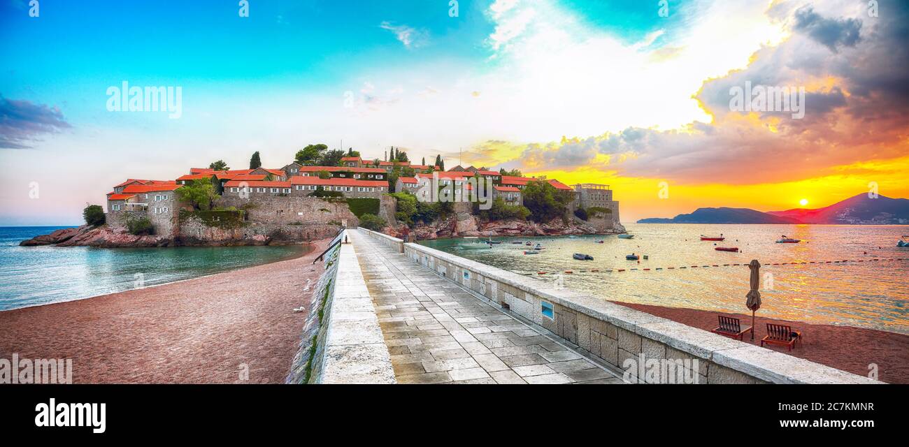 Fantastic sunset view of luxury beach and islet Sveti Stefan near Budva ...