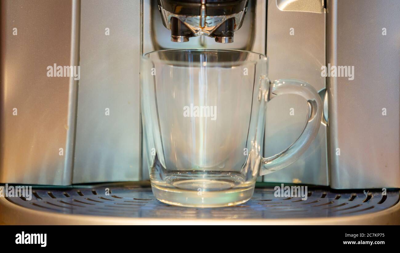 front view coffee cup on coffee machine Stock Photo - Alamy