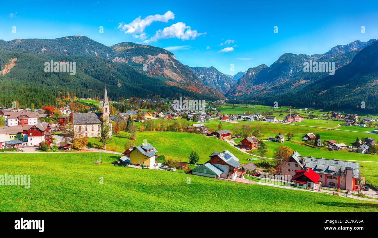 Alpine green fields and traditional wooden houses view of the Gosau ...
